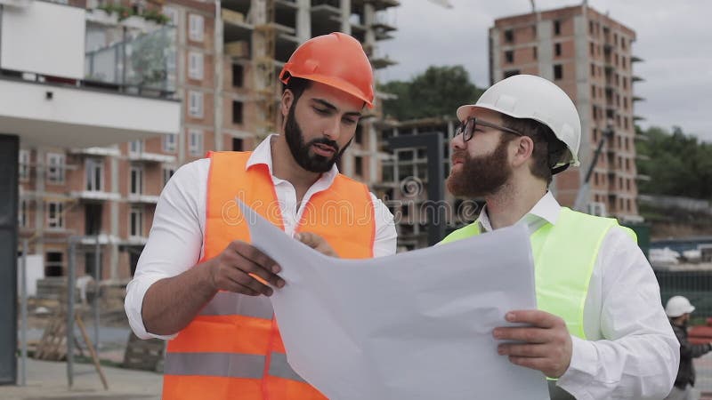 Architect Expert Engineers Talking and Analyze Design Plan Standing ...