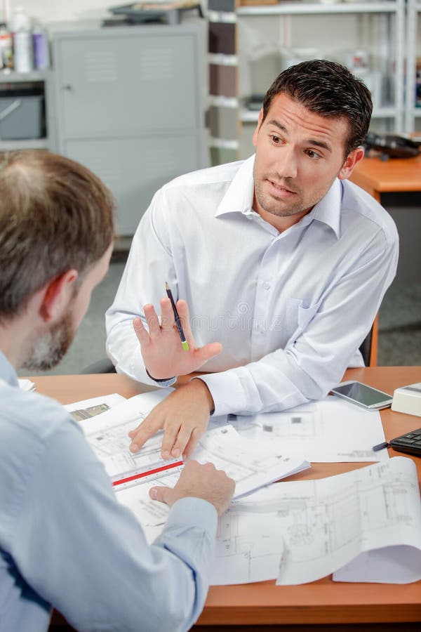 Architect Explaining Costs To Client Stock Image - Image of explain ...