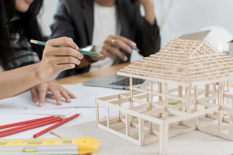 Architect Explaining Project Plan To Clients. Confident Businesswoman ...