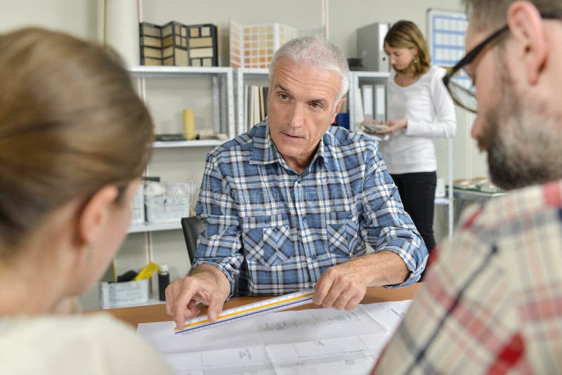 Architect Explaining Something To Client Stock Photo - Image of ...