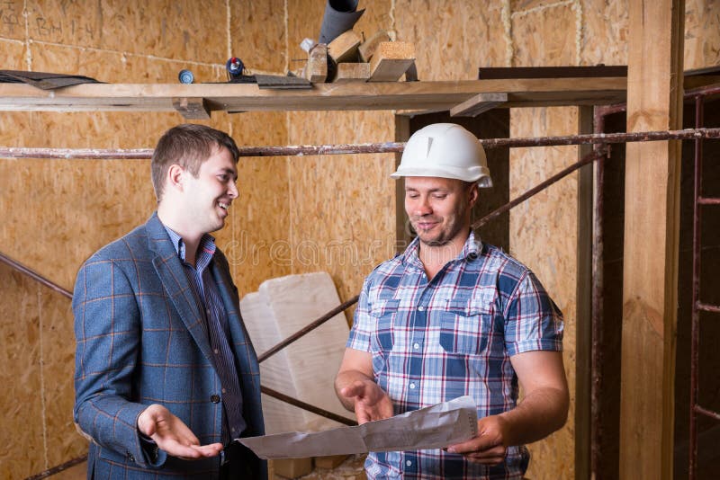 Foreman Inspecting Work on Staircase in New Home Stock Photo - Image of ...
