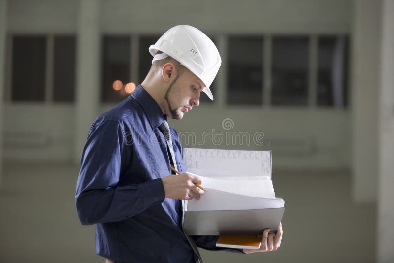 Architect Going through File Folder in Warehouse Stock Image - Image of ...