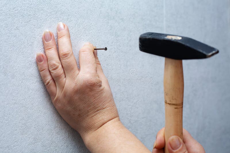 Architect Hammering Nail in Wall Stock Photo - Image of constructor ...