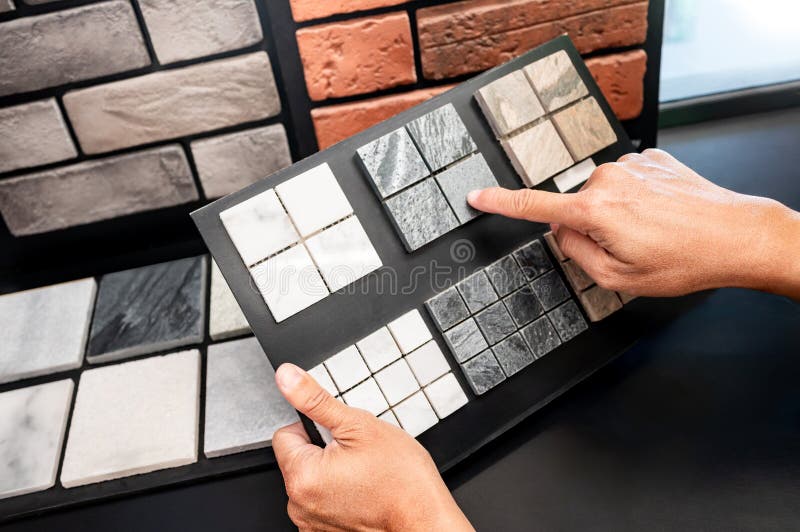 Architect Hand Pointing at Stone Tile Collection Display on Sample ...