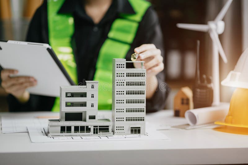 Architect Hands Making Model House. Man Architect Working in the Office ... Architect Hands Making Model House. Man Architect Working in the Office ...