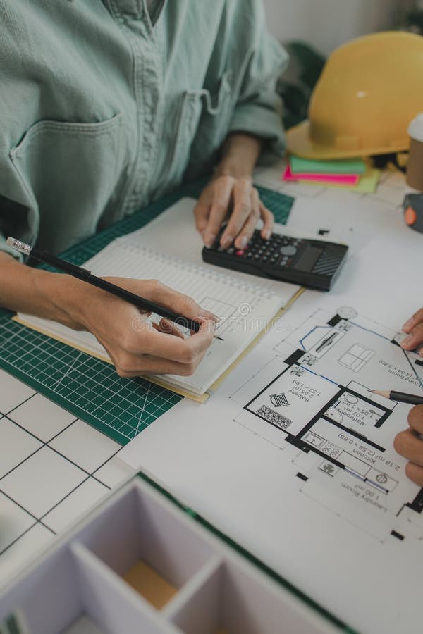 An Architect and His Assistant are Brainstorming and Examining the ...