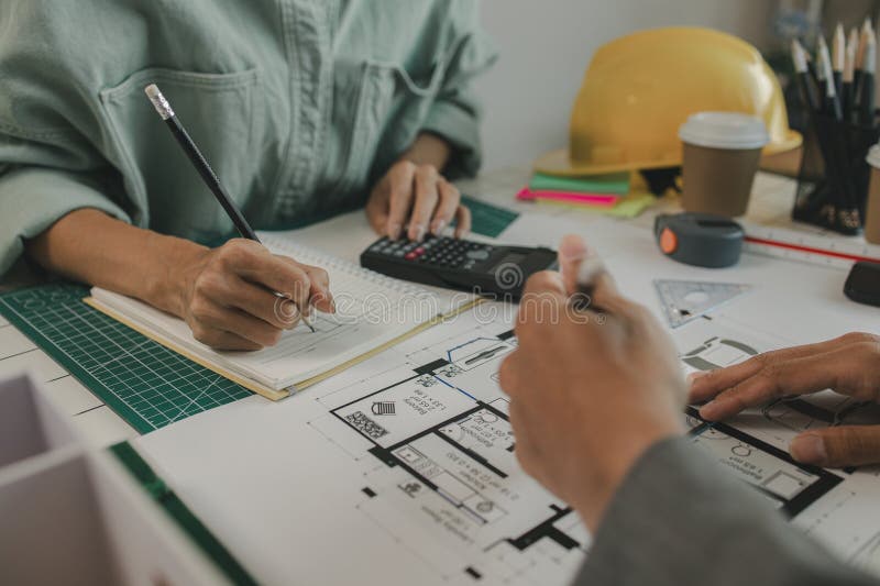An Architect and His Assistant are Brainstorming and Examining the ...