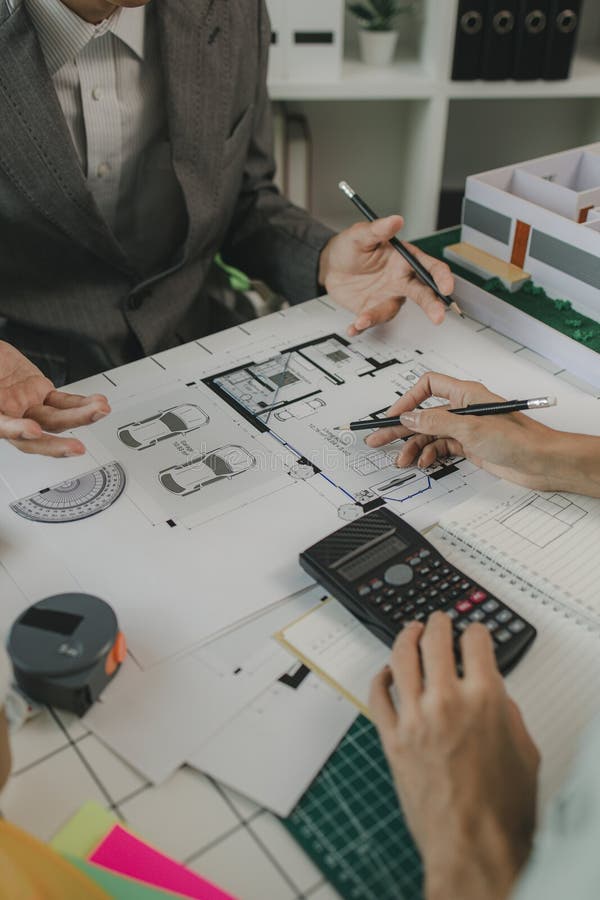 An Architect and His Assistant are Brainstorming and Examining the ...