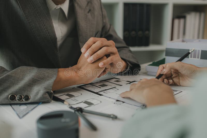 An Architect and His Assistant are Brainstorming and Examining the ...