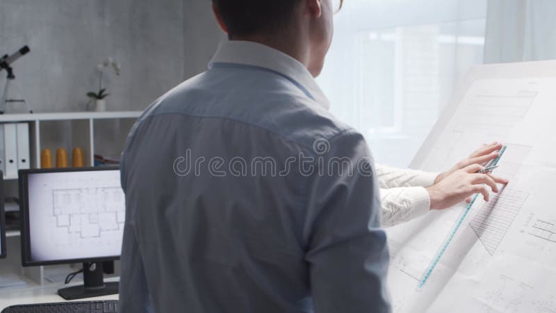 Architect and His Colleague Work in Loft Using Drawing Board and ...