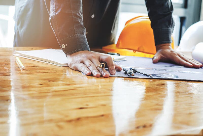 Architect Measuring Scale on Blueprint in Construction Site Stock Photo ...