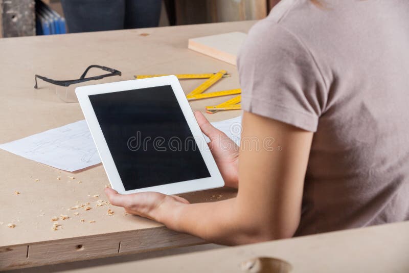 Architect Holding Tablet Computer at Table Stock Photo - Image of ...