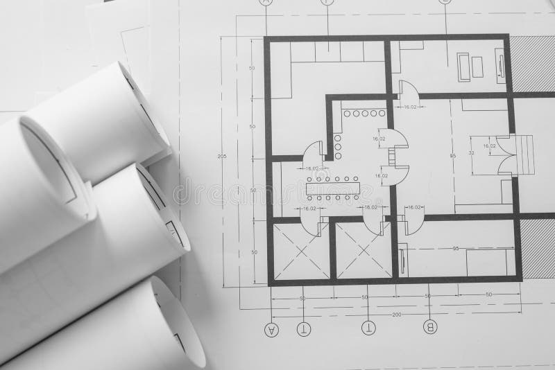 Architect House Plan Roled -up Plans on the Table, High Angle View ...