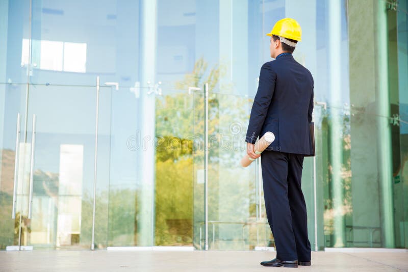 Architect Looking at His Work Stock Photo - Image of rear, blueprint ...