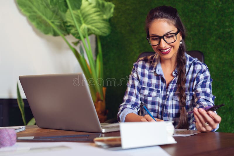 Architect Making Adjustments To Blueprints of Her First Big Solo ...