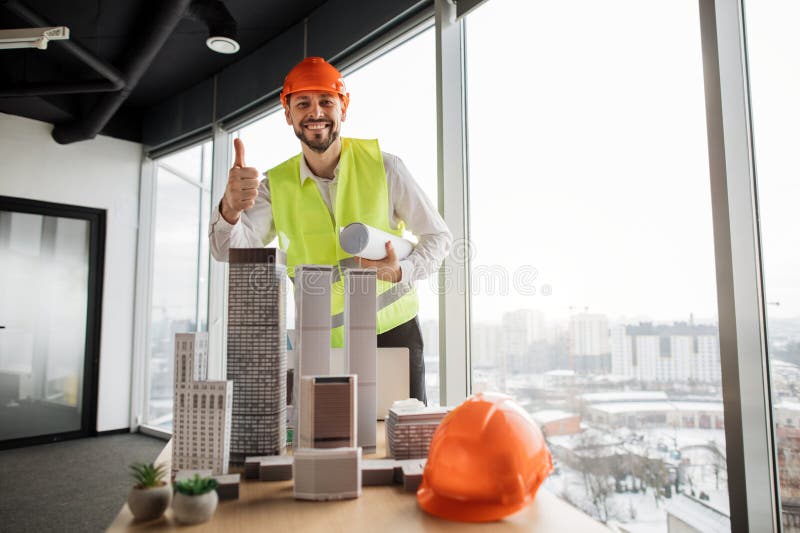 Architect Man or Male Builder Adding Component To a Building Model ...