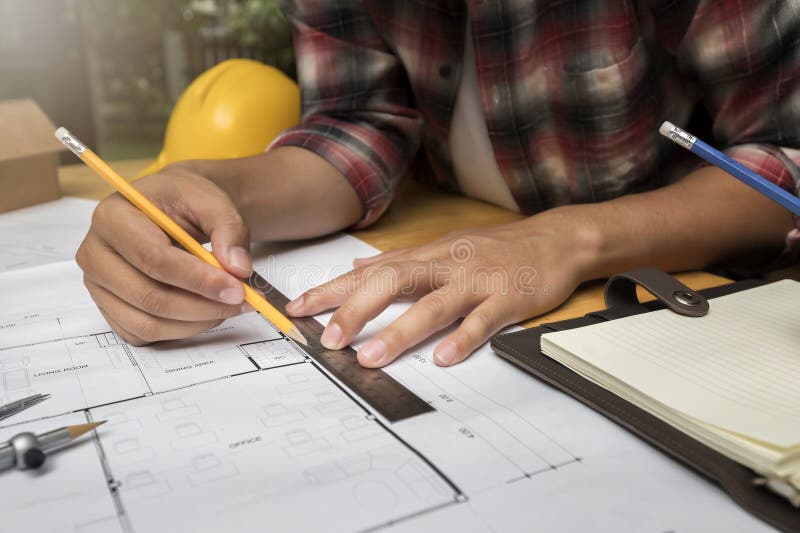 Architect Measuring Scale on Blueprint in Construction Site Stock Image ...