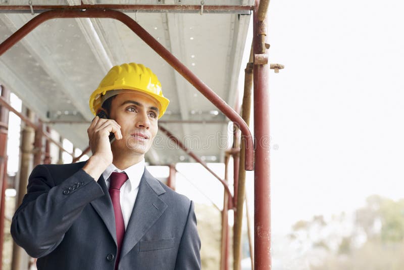Engineer with mobile phone stock image. Image of phone - 10776527
