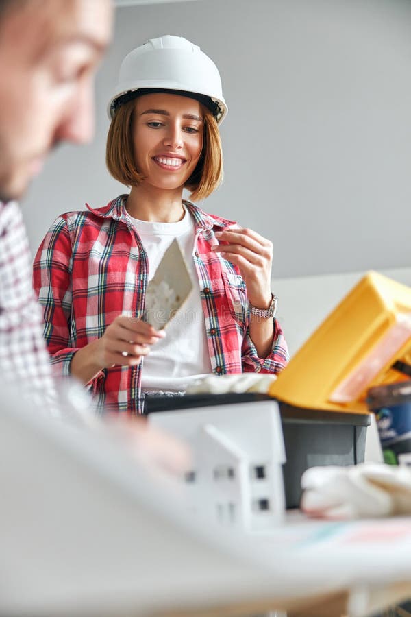 Architect and a Painter with a Paint Scraper Working Indoors Stock ...