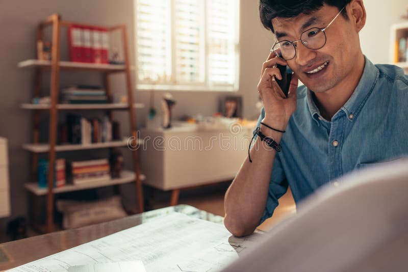 Architect with Plan Answering Phone Call Stock Photo - Image of office ...