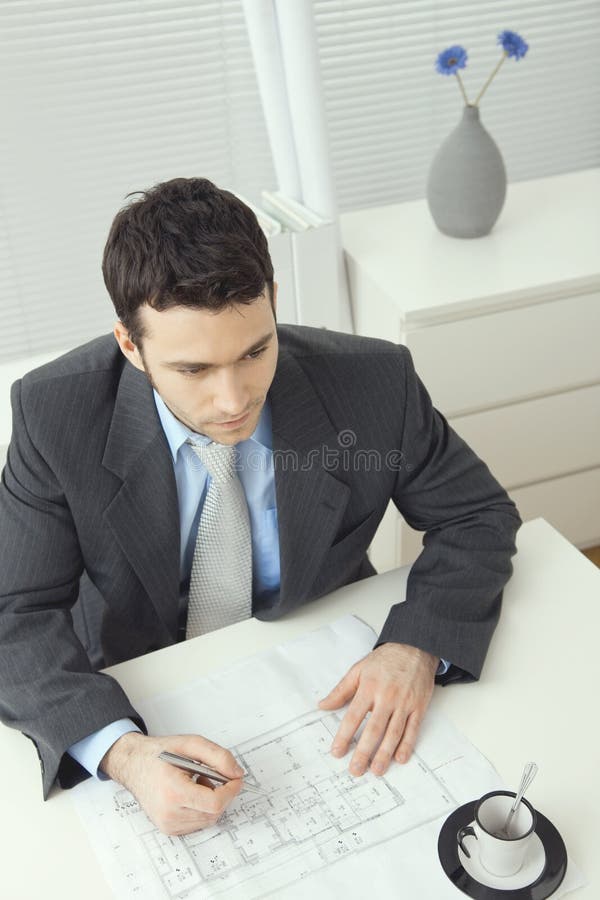 Architect planning at desk stock photo. Image of career - 10131588