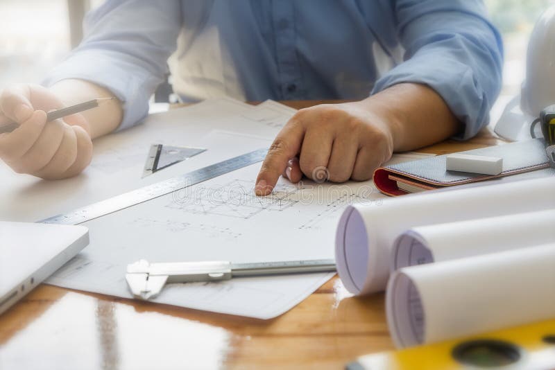 Architect Point at Blueprint Stock Photo - Image of hand, holding: 80083232