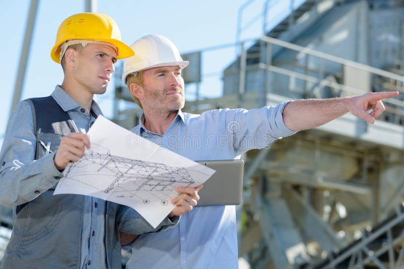Architect Pointing Up while Guiding Stock Photo - Image of female ...