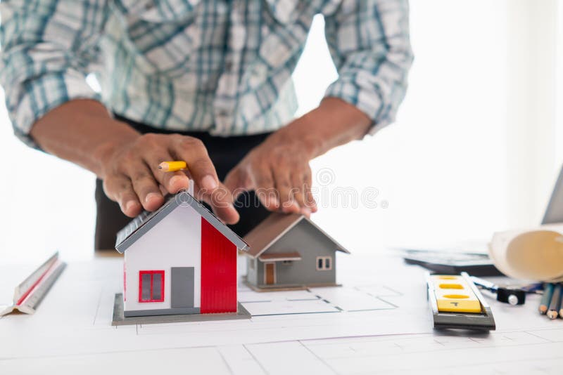 Architect is Preparing House Model and Construction Plans on Blueprints ...