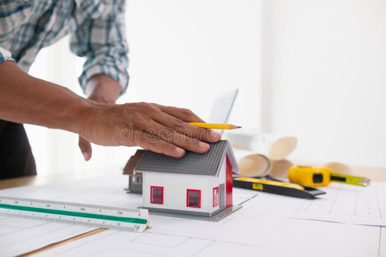 Architect is Preparing House Model and Construction Plans on Blueprints ...
