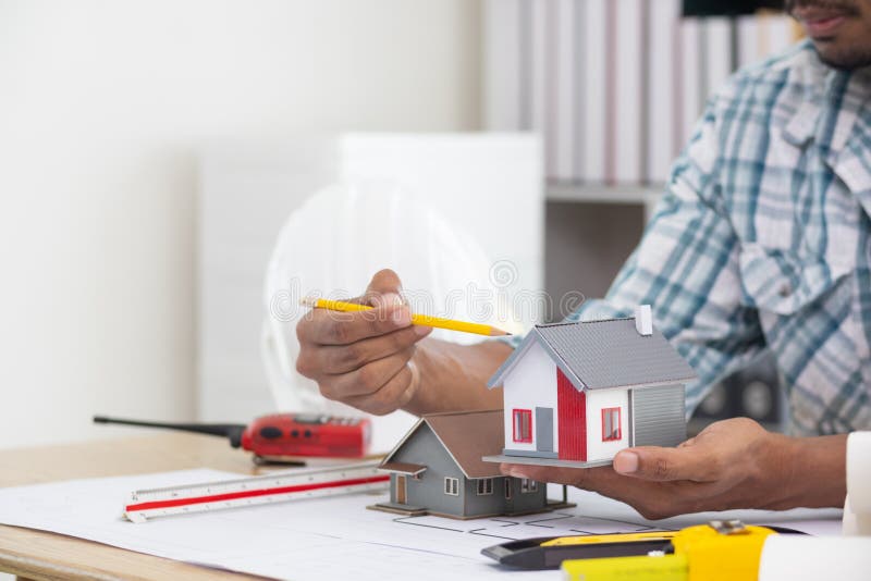 Architect is Preparing House Model and Construction Plans on Blueprints ...