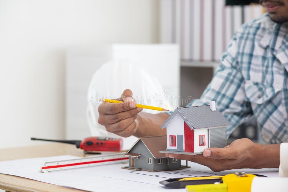 Architect is Preparing House Model and Construction Plans on Blueprints ...
