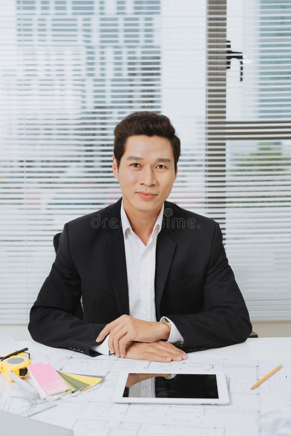 Architect - Project Manager Working with Blueprints in the Office Stock ...