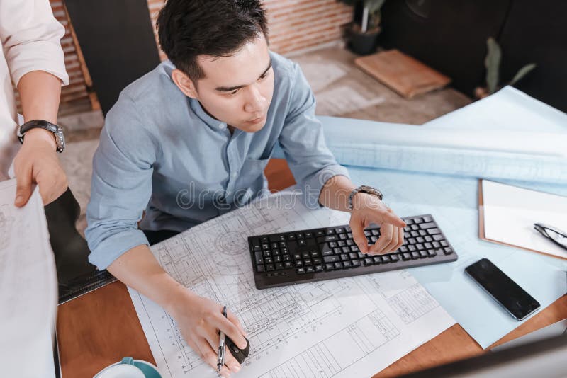 Architect Reading Building and Drawing Outlay Construction Plan As ...