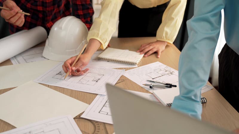 Architect and Safety Engineer Discussion about Building Blueprint ...