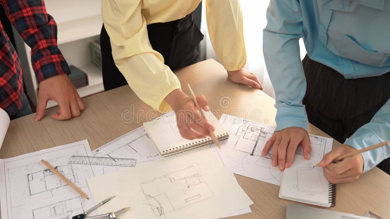 Close Up of Architect Hand Writing Detail of Blueprint with Laptop ...