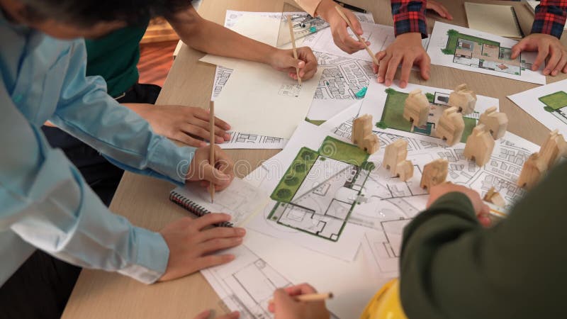 Architects Discuss about House Construction Design with Blueprint ...