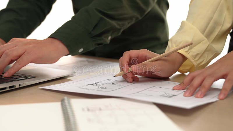 Close Up of Architect Hand Writing Detail of Blueprint with Laptop ...
