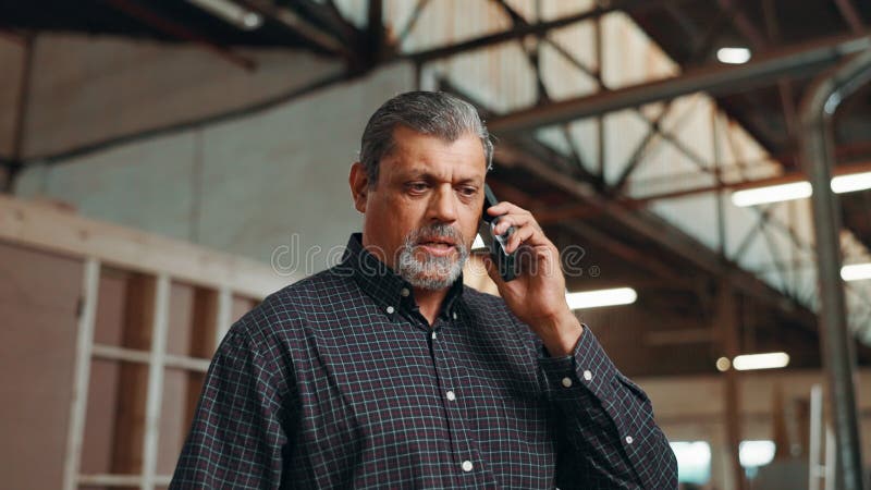 Architect, Serious Problem or Man with Phone Call in Warehouse for ...