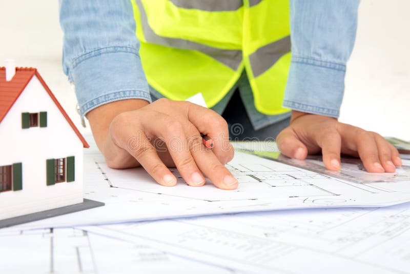 The Architect is Seriously Revising the Drawings on the Table Stock ...