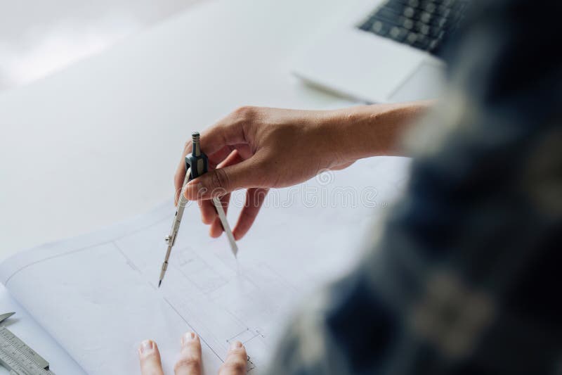 Architect Sketching a Construction Project Working on Project in Modern ...
