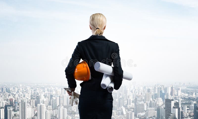 Architect Standing with Construction Drawings Stock Image - Image of ...