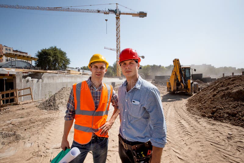 Architect and Structural Engineer Dressed in Orange Work Vests and ...