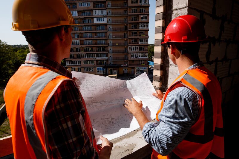 Architect and Structural Engineer Dressed in Shirts, Orange Work Vests ...
