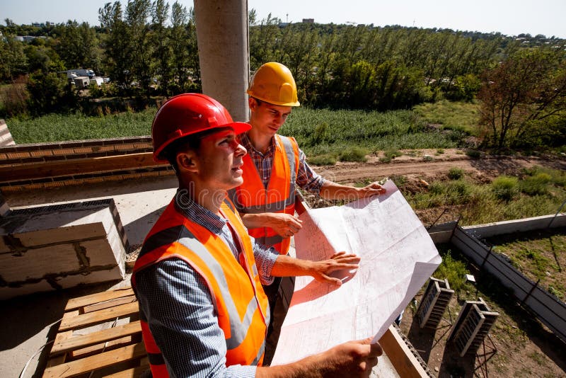 Architect and Structural Engineer Dressed in Shirts, Orange Work Vests ...