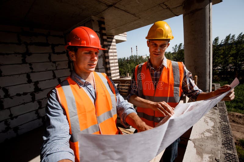 Architect and Structural Engineer Dressed in Shirts, Orange Work Vests ...