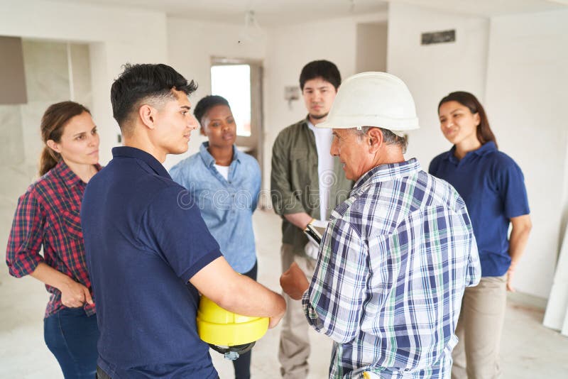 Architect Supervisioning Team Group of Construction Workers Onsite Stock Image - Image of ...