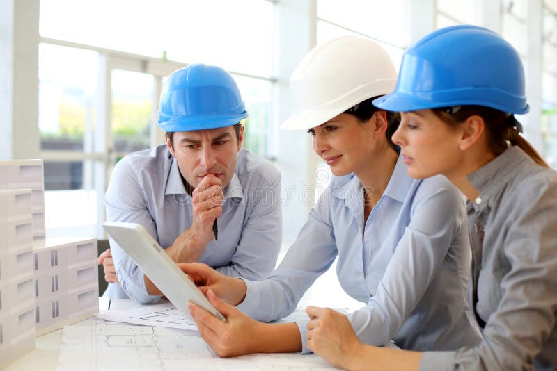 Group of Architects Planning on a New Project Stock Photo - Image of ...
