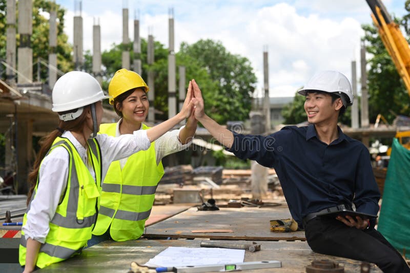 Architect Team and Engineers are Making High Five Together. Industry ...