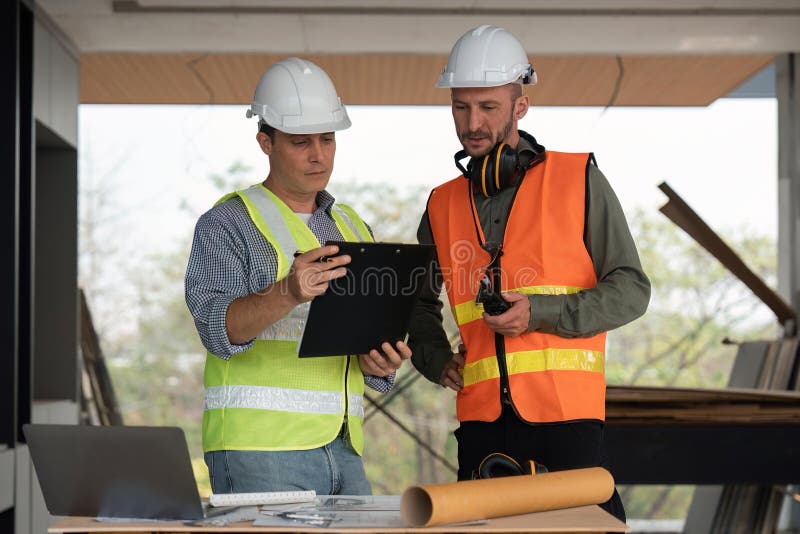 Architect Team Looking at Plan and Talking about Working on Big Project ...