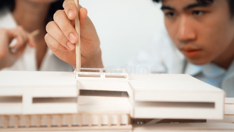 Architect Team Using Pencil To Test House Model Durability. Closeup ...